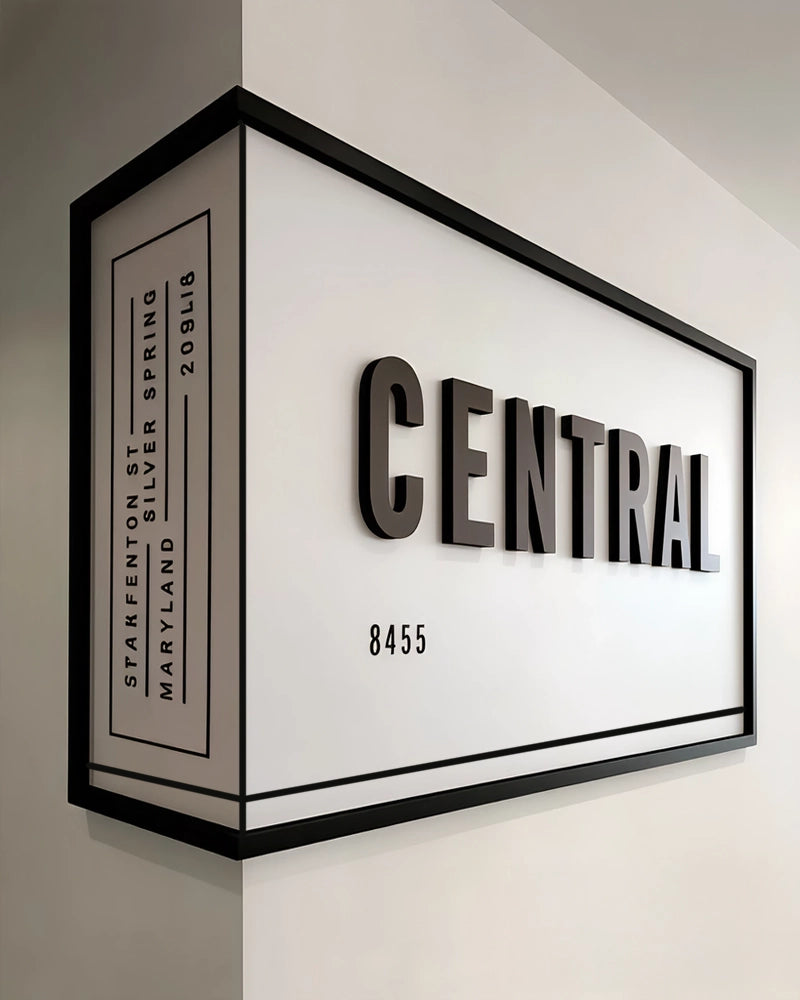 Architectural Corner Signage with Bold Typography and Framed Dimension ...